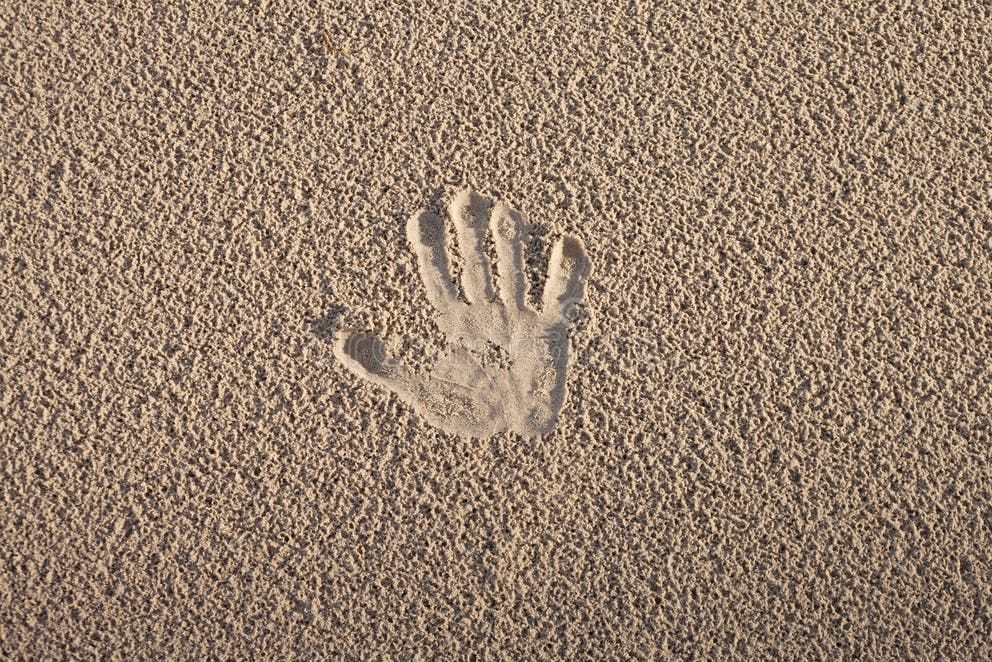 Stamp in sand. stock photo. Image of handprint, stamp - 26634394