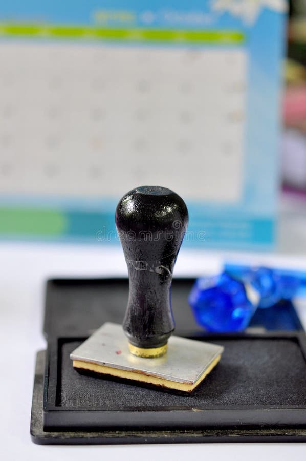 Stamper with stamp pad stock image. Image of guarantee - 34679733
