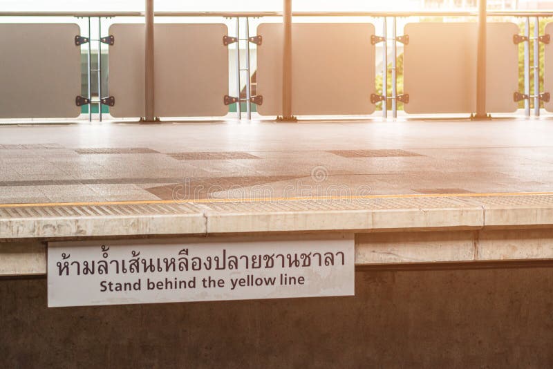 Stand Behind the Yellow Line Safety Sign. Stock Photo - Image of plaque ...