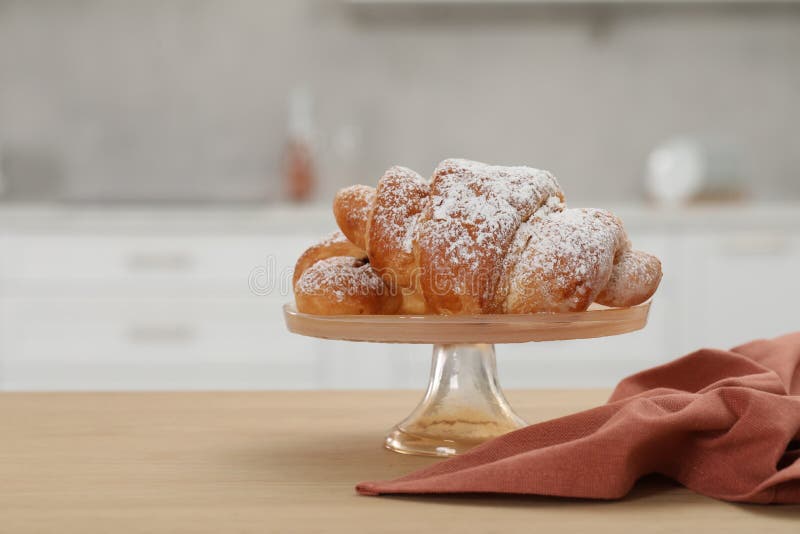 Stand with Delicious Croissants and Napkin on Table in Kitchen, Space ...