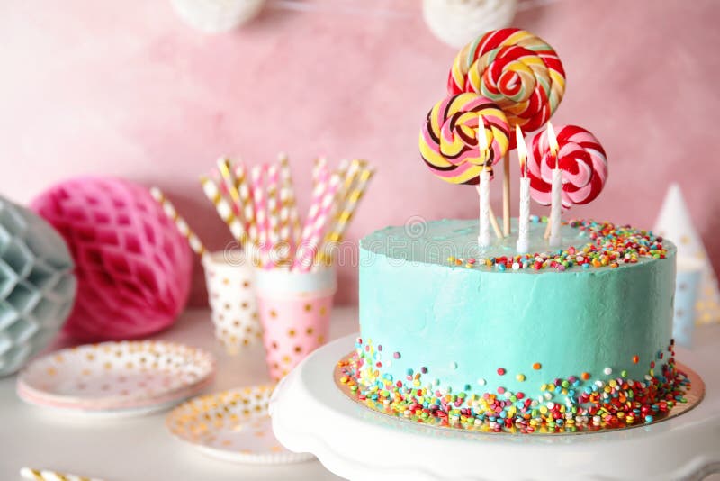 Stand with Fresh Delicious Cake and Birthday Decorations on Table ...
