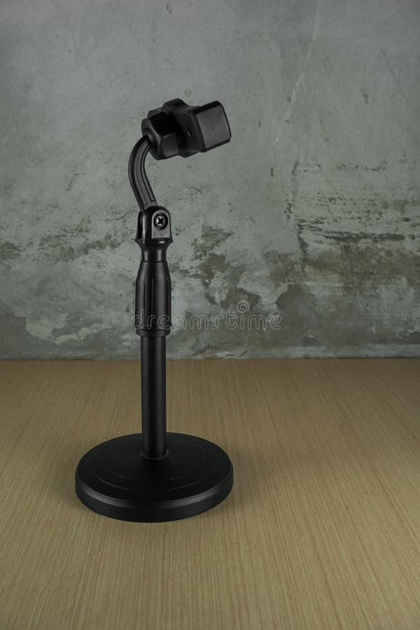 Stand Holder for Mobile Phone on Wooden Floor Stock Photo - Image of ...