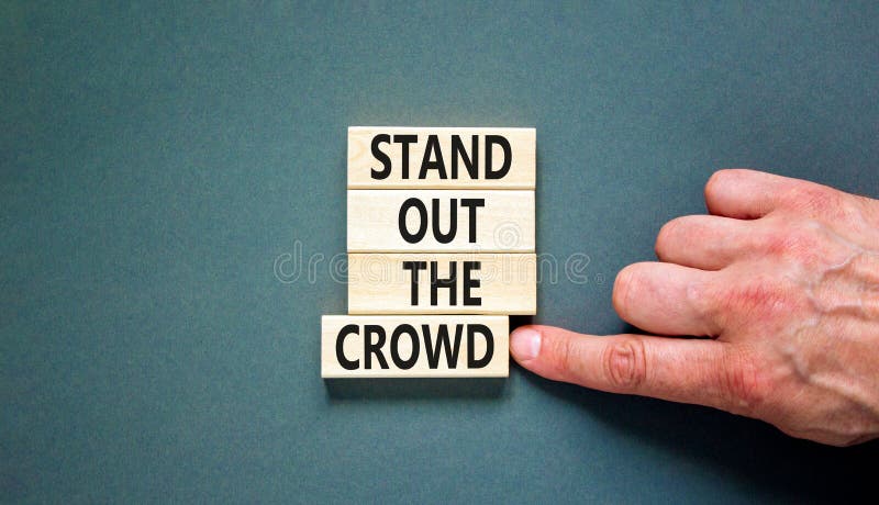 Stand Out the Crowd Symbol. Concept Words Stand Out the Crowd on Wooden ... Stand Out the Crowd Symbol. Concept Words Stand Out the Crowd on Wooden ...