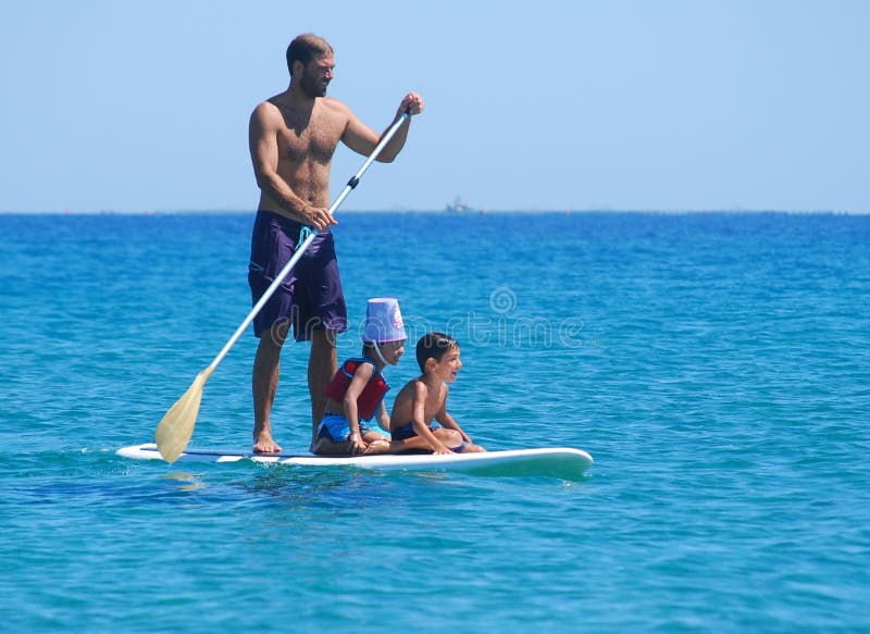 SUPing with Children is Exhilarating Stock Photo - Image of pale ...