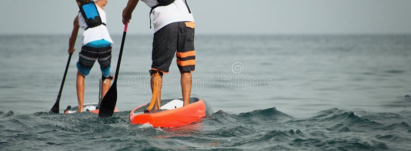 Stand Up Paddle Group on the Sea Stock Photo - Image of paddleboarding ...