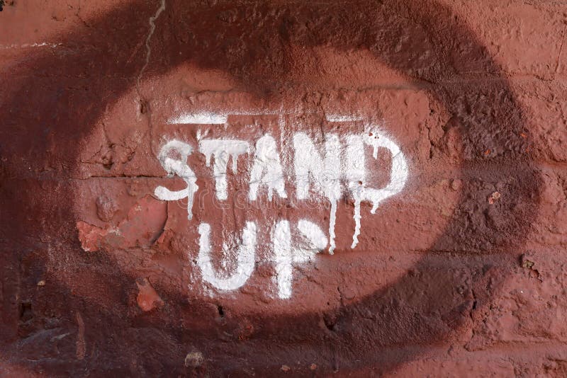 Stand Up sign on wall stock photo. Image of design, concept - 250353900