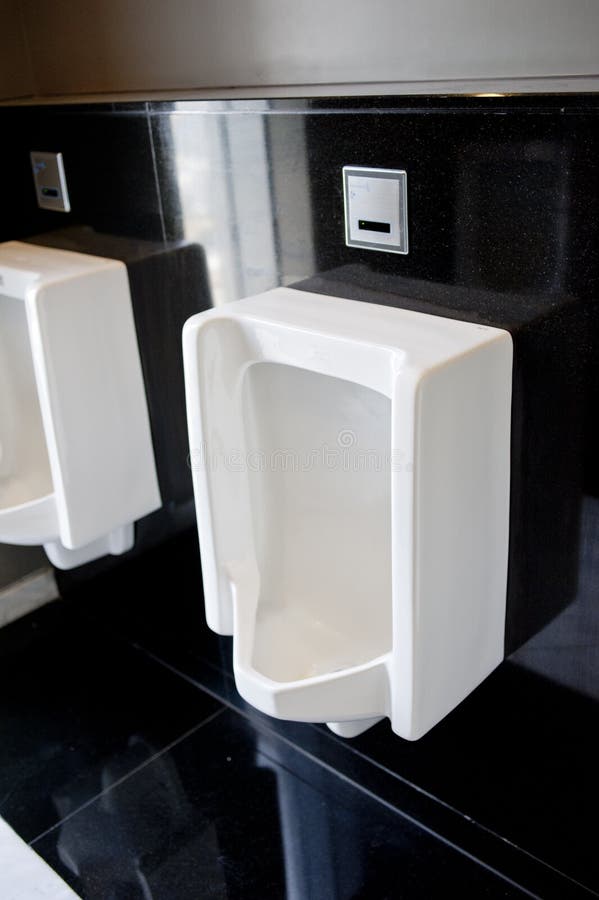 Two Urinals for Adults and One for Children - a White Porcelain Urinal ...