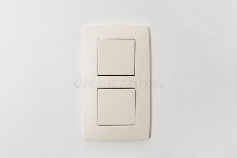 Standard Household Light Switch on a Painted White Wall after a Long ...