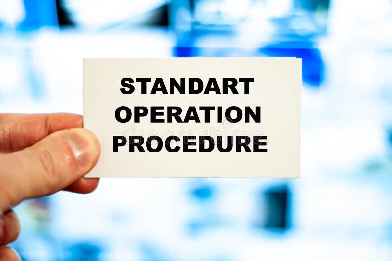 STANDARD OPERATING PROCEDURE - a Person Holds Paper in His Hands Stock ...