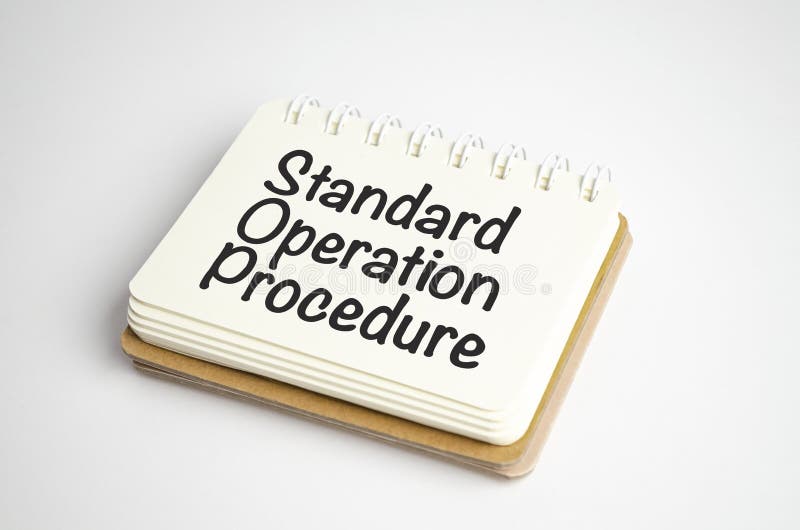 Standard Operating Procedure Text Written on Notebook on Grey ...