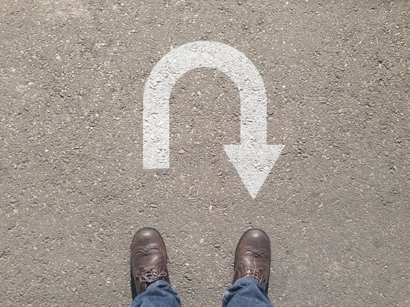 Standing on the Asphalt Concrete Floor in Front of U Turn Symbol Stock ...