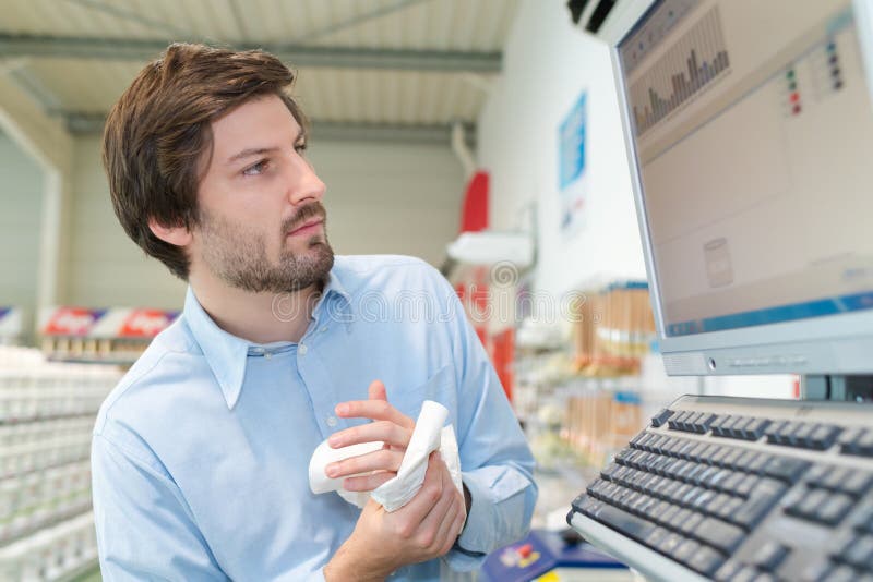 Standing Business Man Working on Computer in Warehouse Stock Image ...