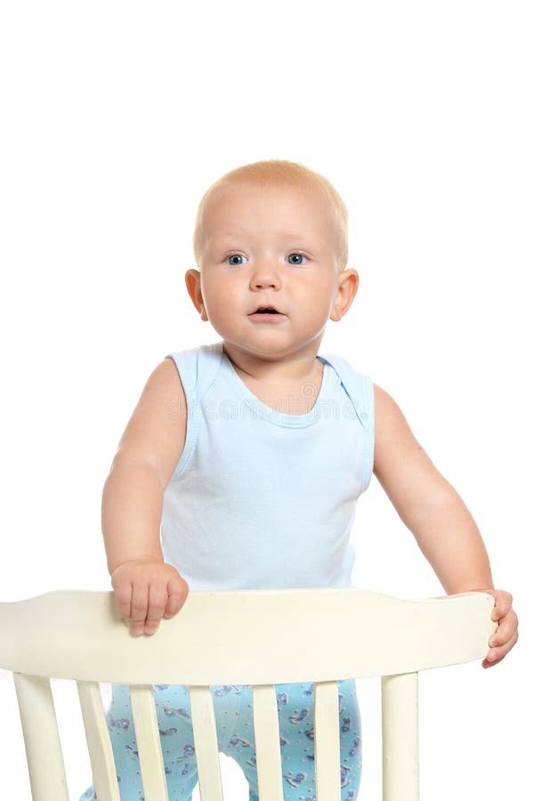 Standing on the chair stock photo. Image of small, adorable - 44346718