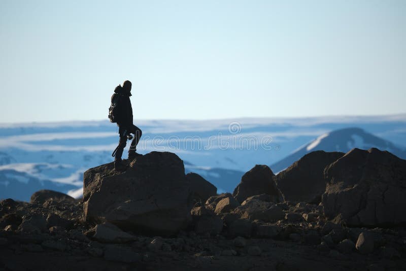 Standing on a cliff stock image. Image of explorer, photographer - 66998315