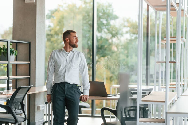 Standing and Enjoying the Break. Man in Formal Clothes is Working in ...