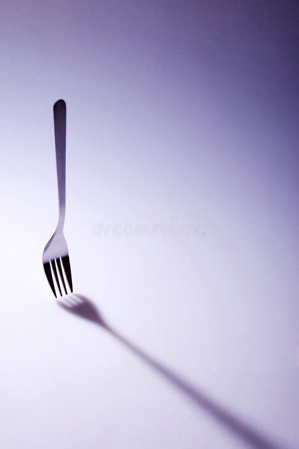 A Standing Fork and Its Shadow Stock Image - Image of still, concept ...