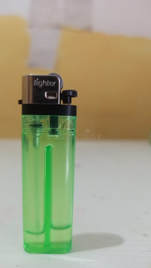 Standing green lighter editorial stock photo. Image of lighter - 276543568