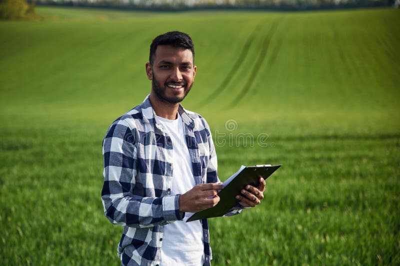 Making Selfie, Holding Notepad. Handsome Indian Man is on the ...