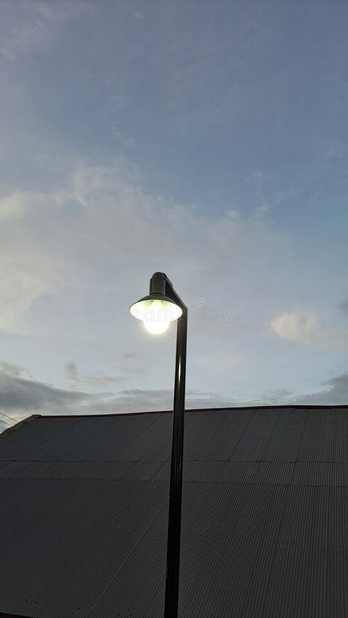 Standing lamp on rooftop stock photo. Image of sunset - 263140578