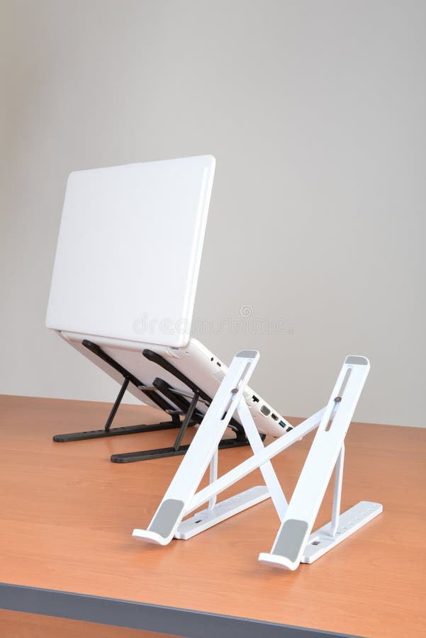 Standing Laptop Holder Set Up with Notebook on Desk Stock Photo - Image ...