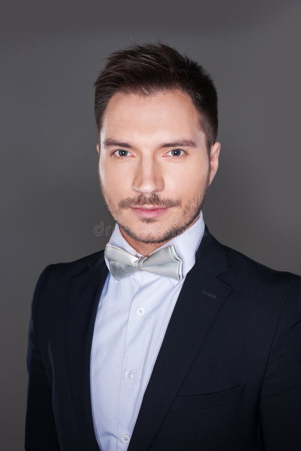 Standing and Looking at Camera Isolated Over Grey Background Stock ...