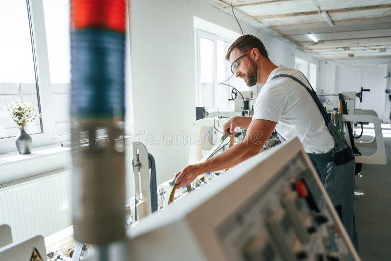 Standing by the Machine. Handsome Man is Working at the Factory of ...