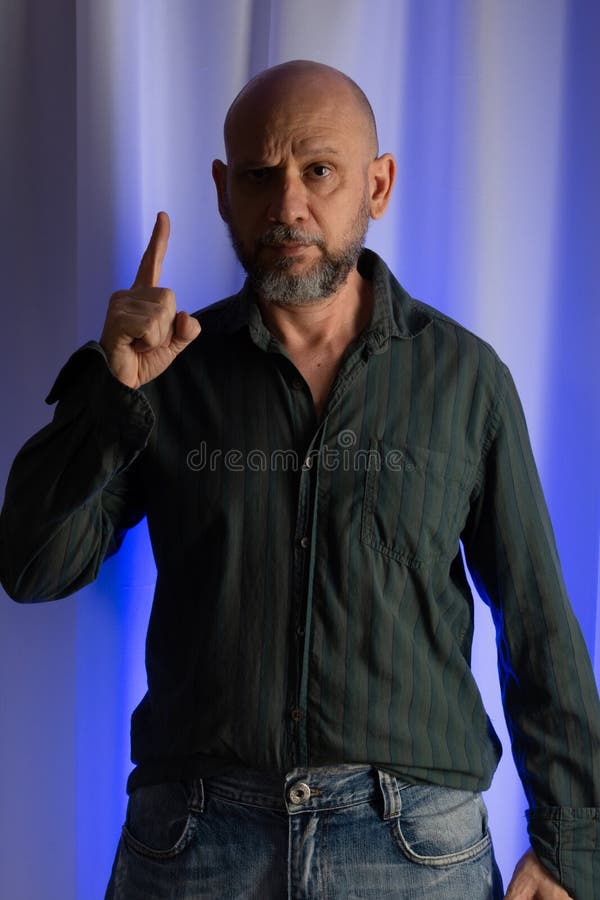 Standing Man Making Hand Gestures. Studio Portrait with Blue Filter ...