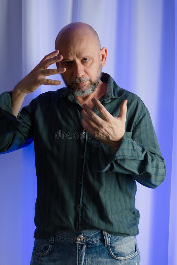 Standing Man Making Hand Gestures. Studio Portrait with Blue Filter ...