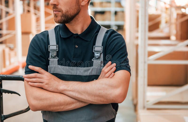 Standing Near the Platform Trolley. Employee in Uniform is Working in ...