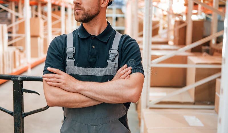 Standing Near the Platform Trolley. Employee in Uniform is Working in ...