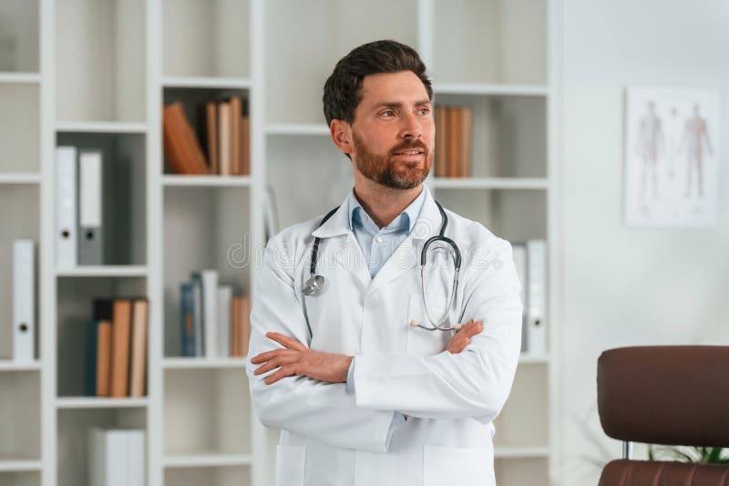 Standing in the Office. Doctor in Formal Clothes is Working in the ...