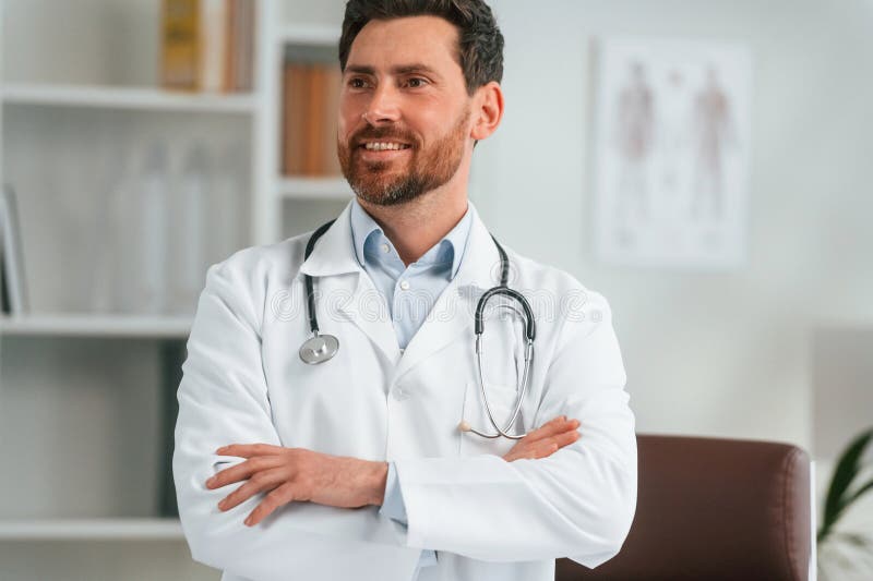 Standing in the Office. Doctor in Formal Clothes is Working in the ...