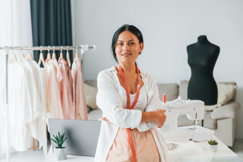 Standing and Posing. Seamstress is in Her Office that is with Different ...