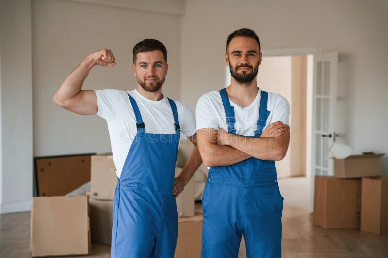 Standing Posing Two Moving Service Employees Room Stock Photos - Free ...