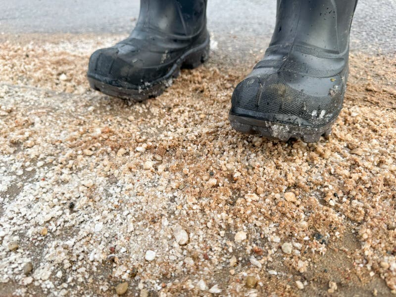Standing with Rubber Boots on a Sandy Road with Salt Stock Photo ...