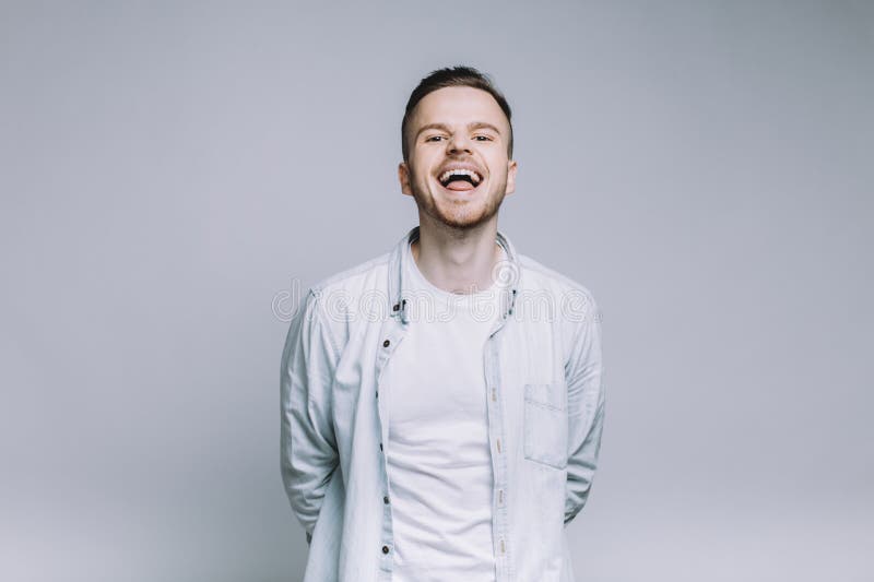 Standing Smiling Young Man with Beard in a White Shirt Stock Image ...