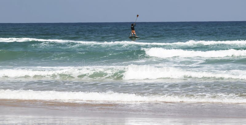 Standing Surfboard in Waves Stock Image - Image of balance, surf: 94316589