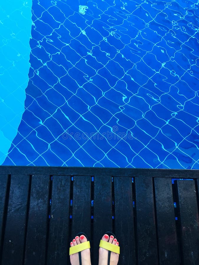 Standing at swimming pool stock image. Image of resort - 128248087