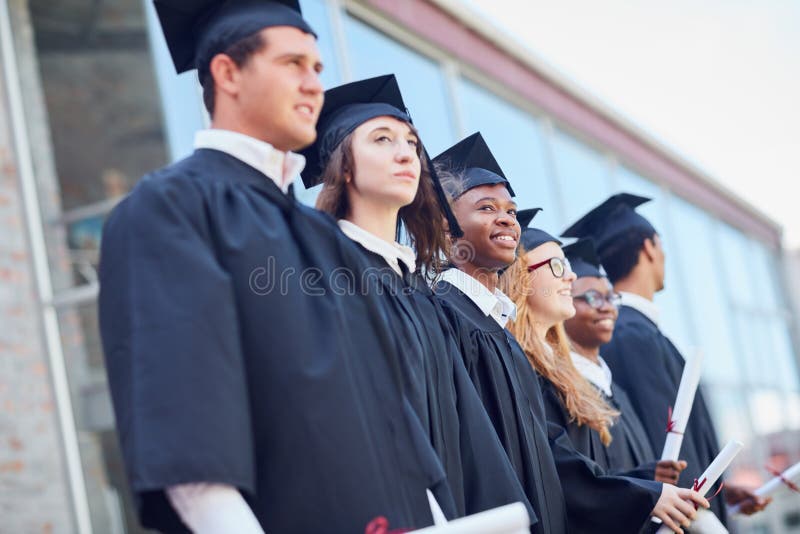 Standing Tall at Their Graduation. a Happy Group of Students Standing ...