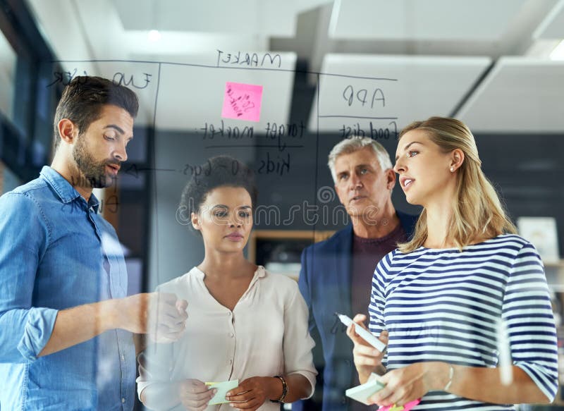 Standing Together To Get Things Done. a Group of Colleagues Having a ...