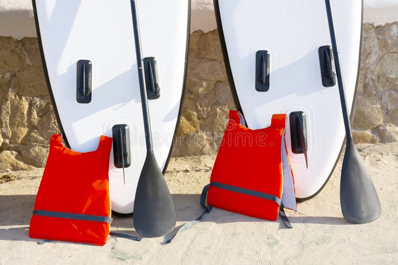 Paddle Boards, Rowing and Life Jackets Stock Photo - Image of gear ...