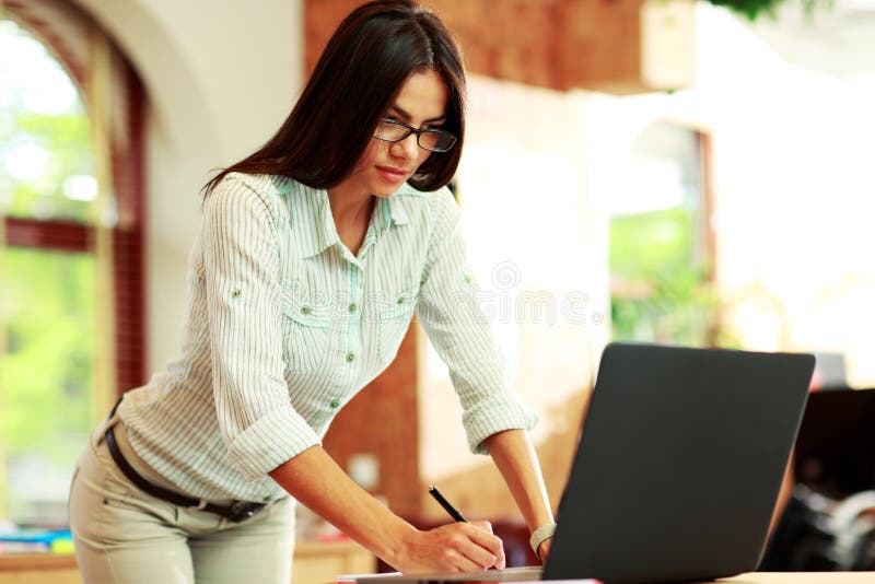 Standing Woman Using Her Laptop Stock Image - Image of pretty ...