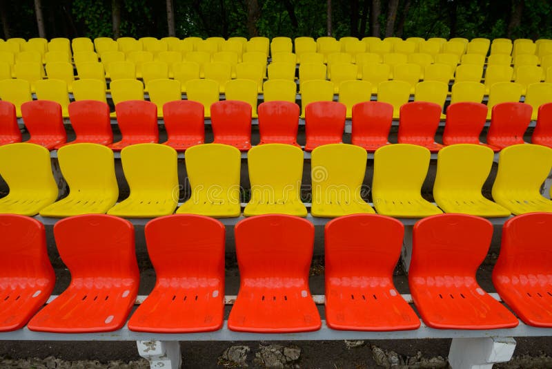 Stands of a Small Stadium with Rows of Yellow and Red Seats Stock Image ...