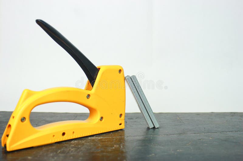 Yellow Gun Tacker on Black and White Background Stock Photo - Image of ...