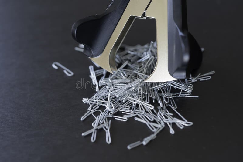 Staple Pin Remover with Pile of Staple Pins Stock Image - Image of work ...
