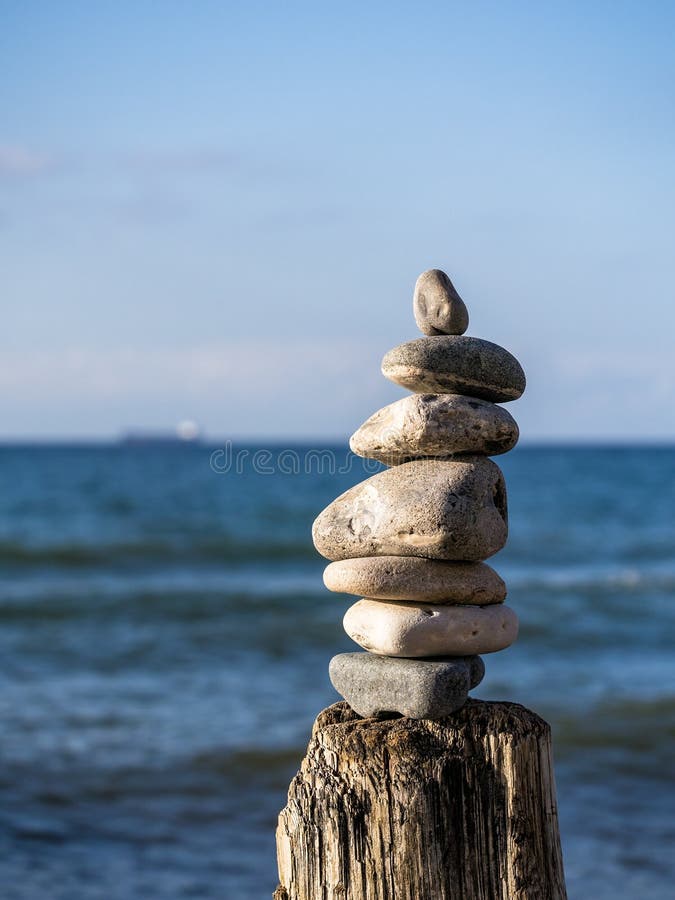 Staple of Stones on a Groyne Stock Photo - Image of tower, evening ...