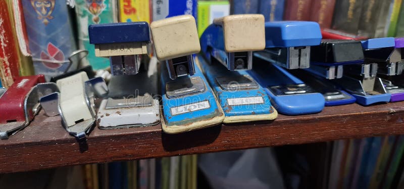Stapler Collection in the Book Rack Stock Photo - Image of blue ...