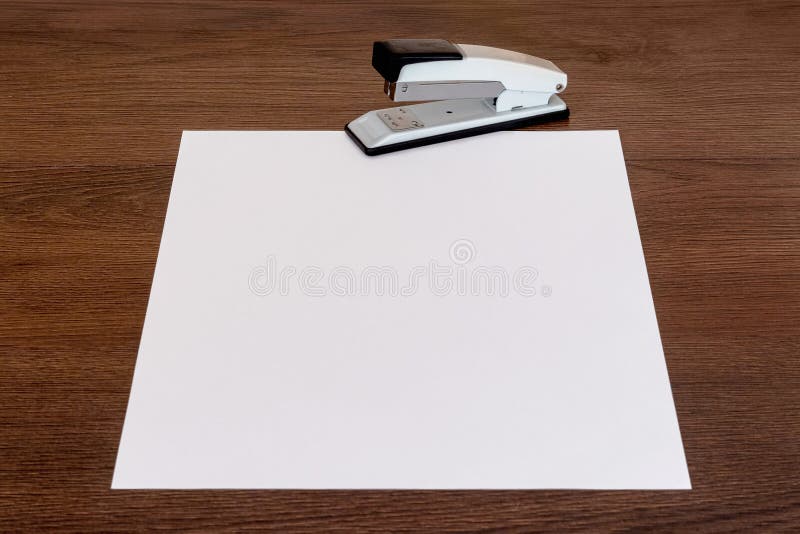 Stapler on Desk in Office Near Blank Piece of Paper. Copy Space_ Stock ...