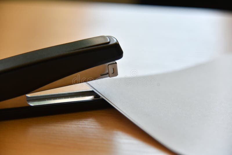 Stapler with Paper on the Office Table Stock Photo - Image of tool ...