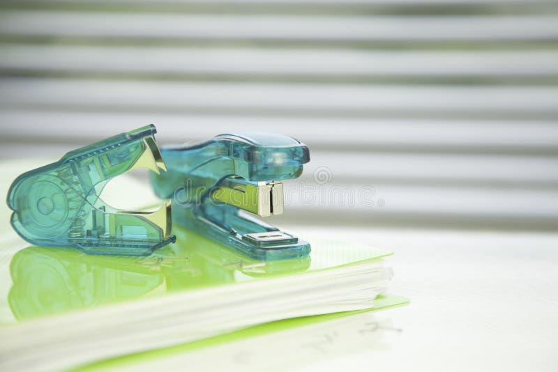 Stapler,staple Remover on a Green Folder, Stock Photo - Image of copy ...